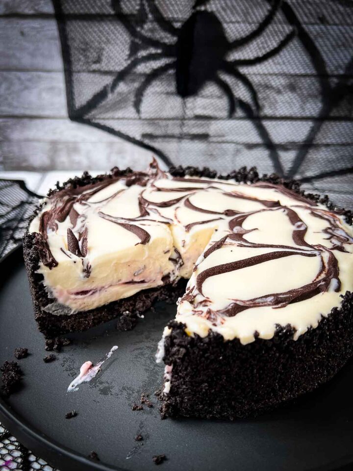 Spooktacular Cheesecake with "Bloody" Raspberry Filling